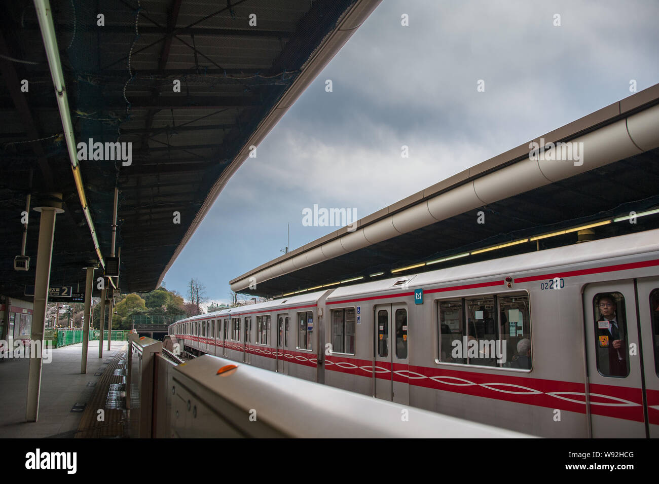 Tokyo, Japan - April 2019: Red and White Japanese commuter train at a ...