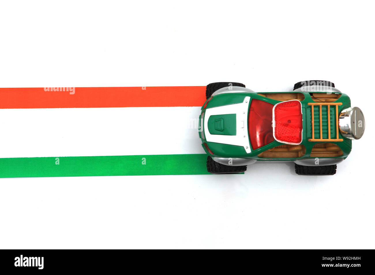 Toy car moving on a tricolored track Stock Photo - Alamy