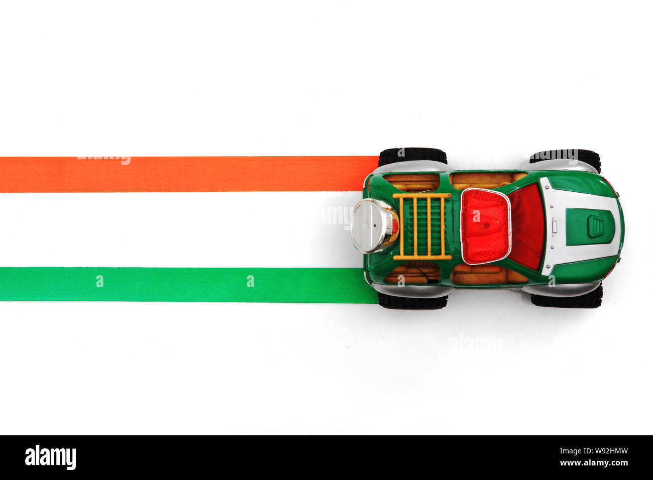 Toy car moving on a tricolored track Stock Photo - Alamy