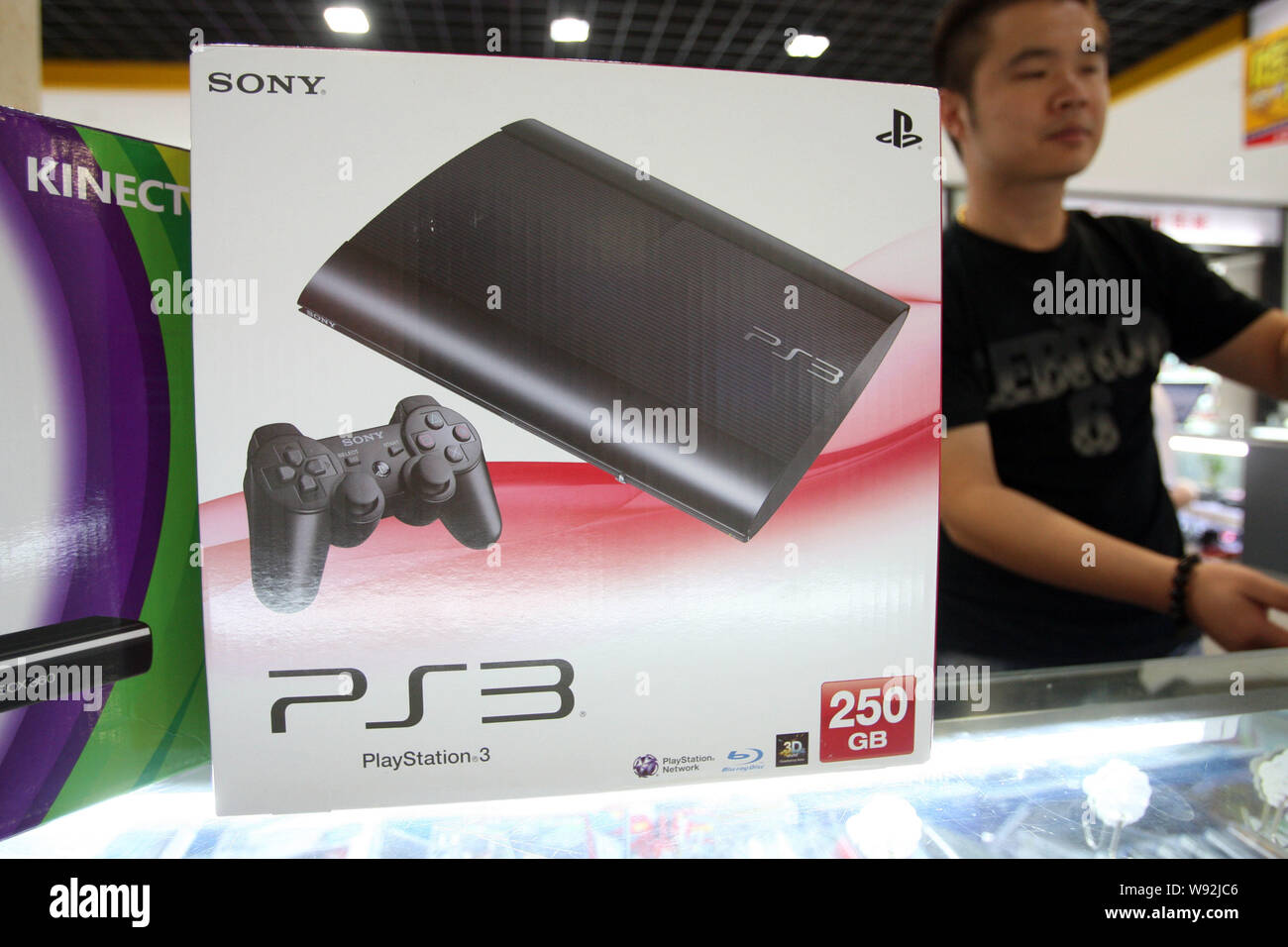 Sony PS3 and Microsoft XBOX 360 game consoles are for sale at a stall ...
