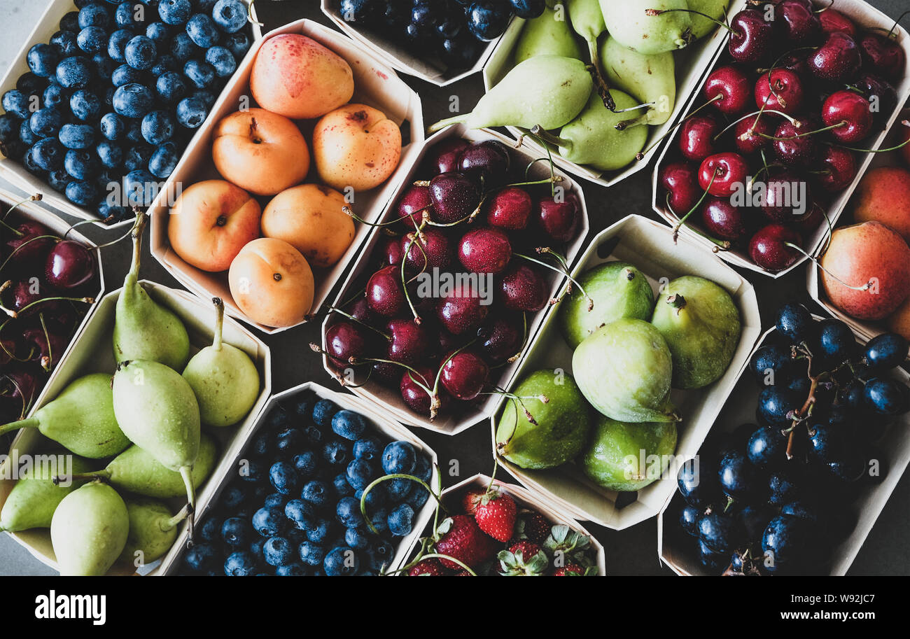 Summer fruit and berry assortment in wooden eco-friendly boxes Stock ...
