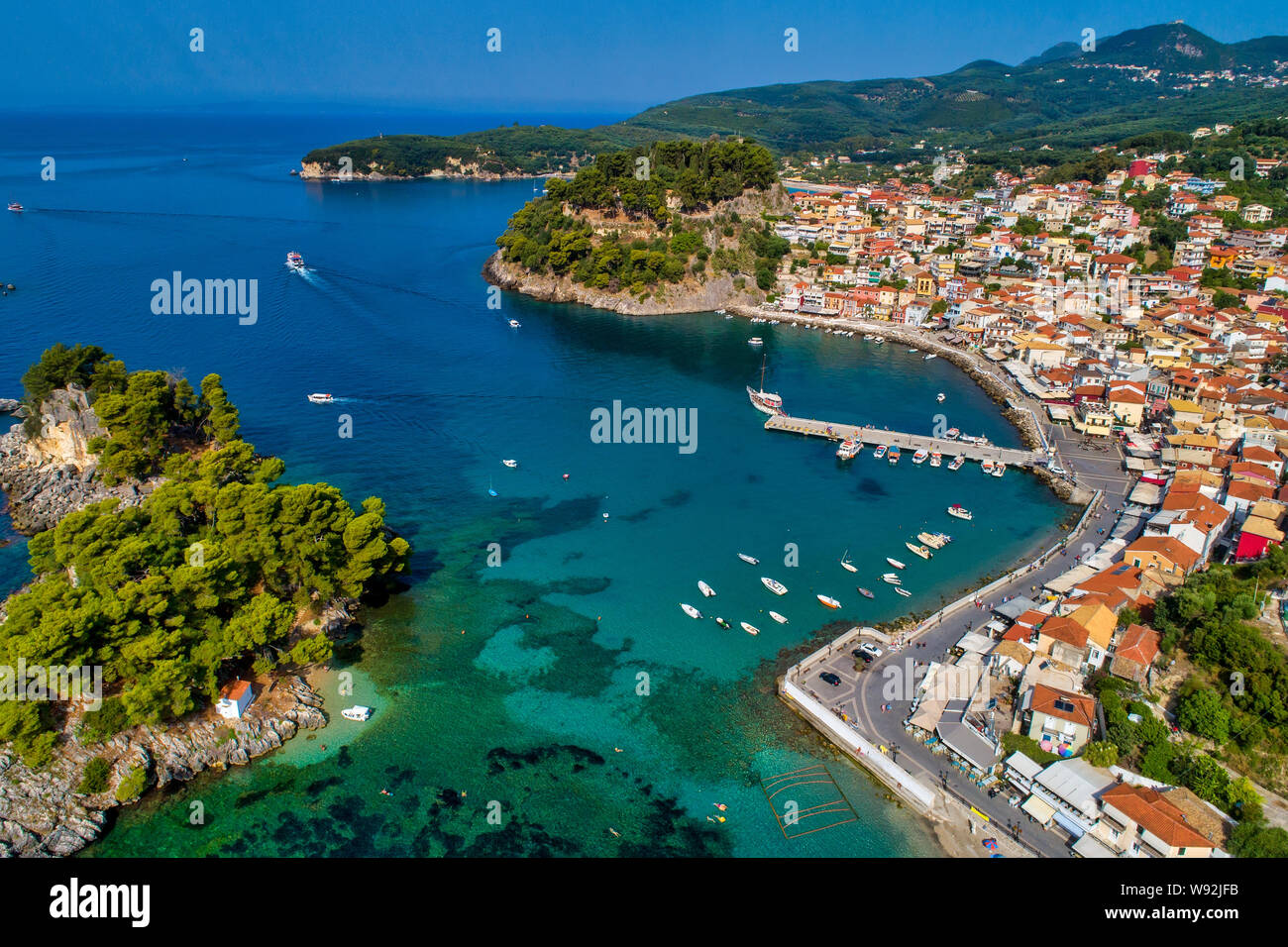 Aerial cityscape view of the coastal city of Parga, Greece during the ...