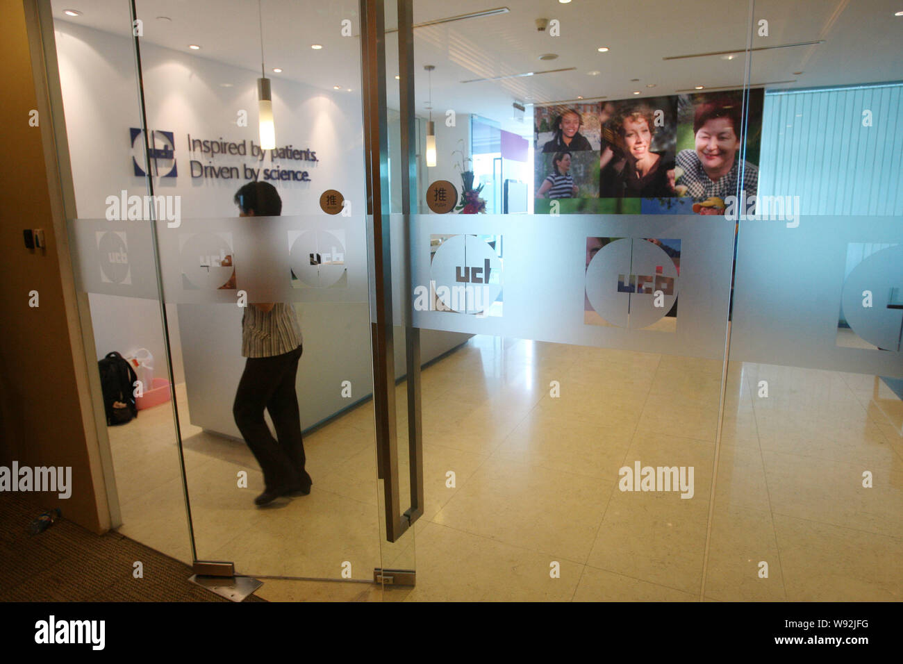 An employee walks past the front desk at the office of UCB Trading ...