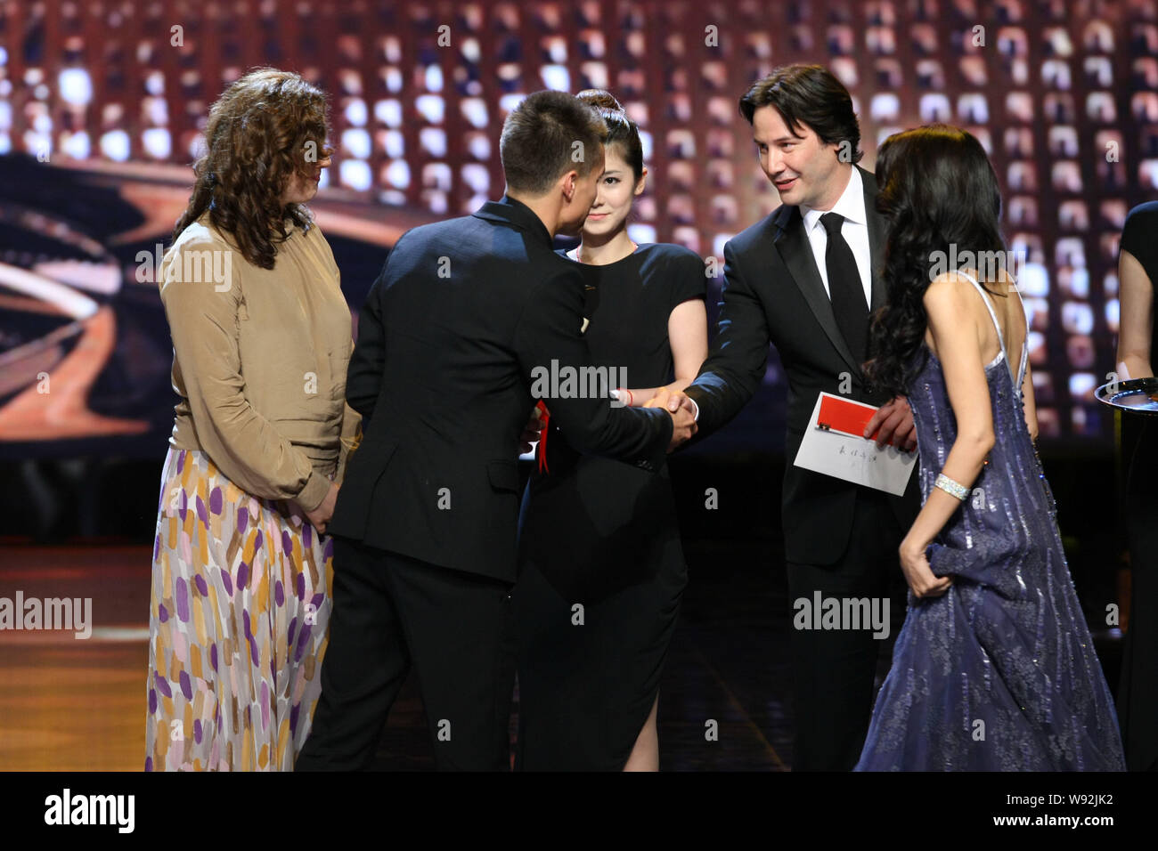 Canadian actor and director Keanu Reeves, second right, shakes hands with Russian director and ...