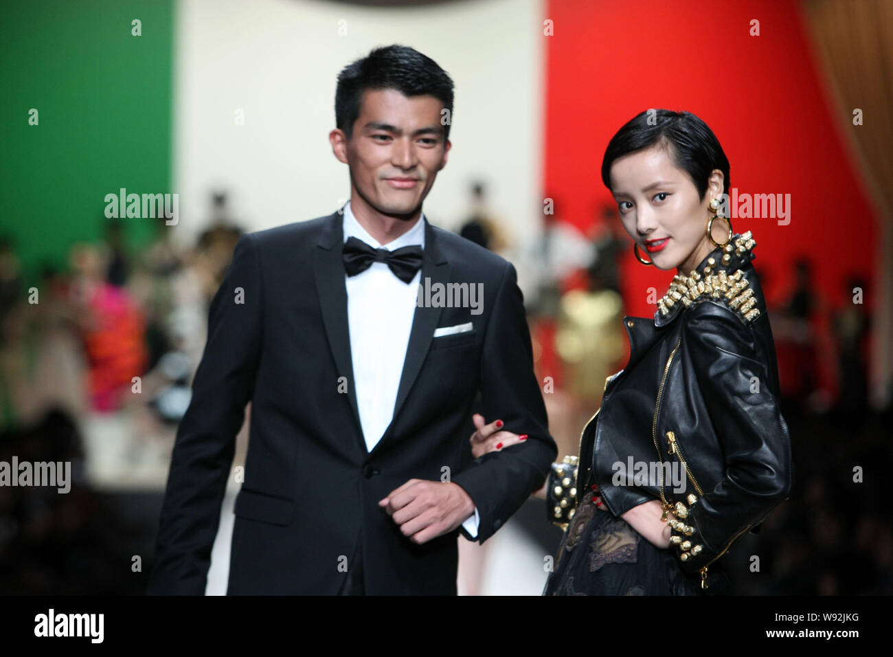 Chinese model Pei Bei, right, and another model display new creations ...