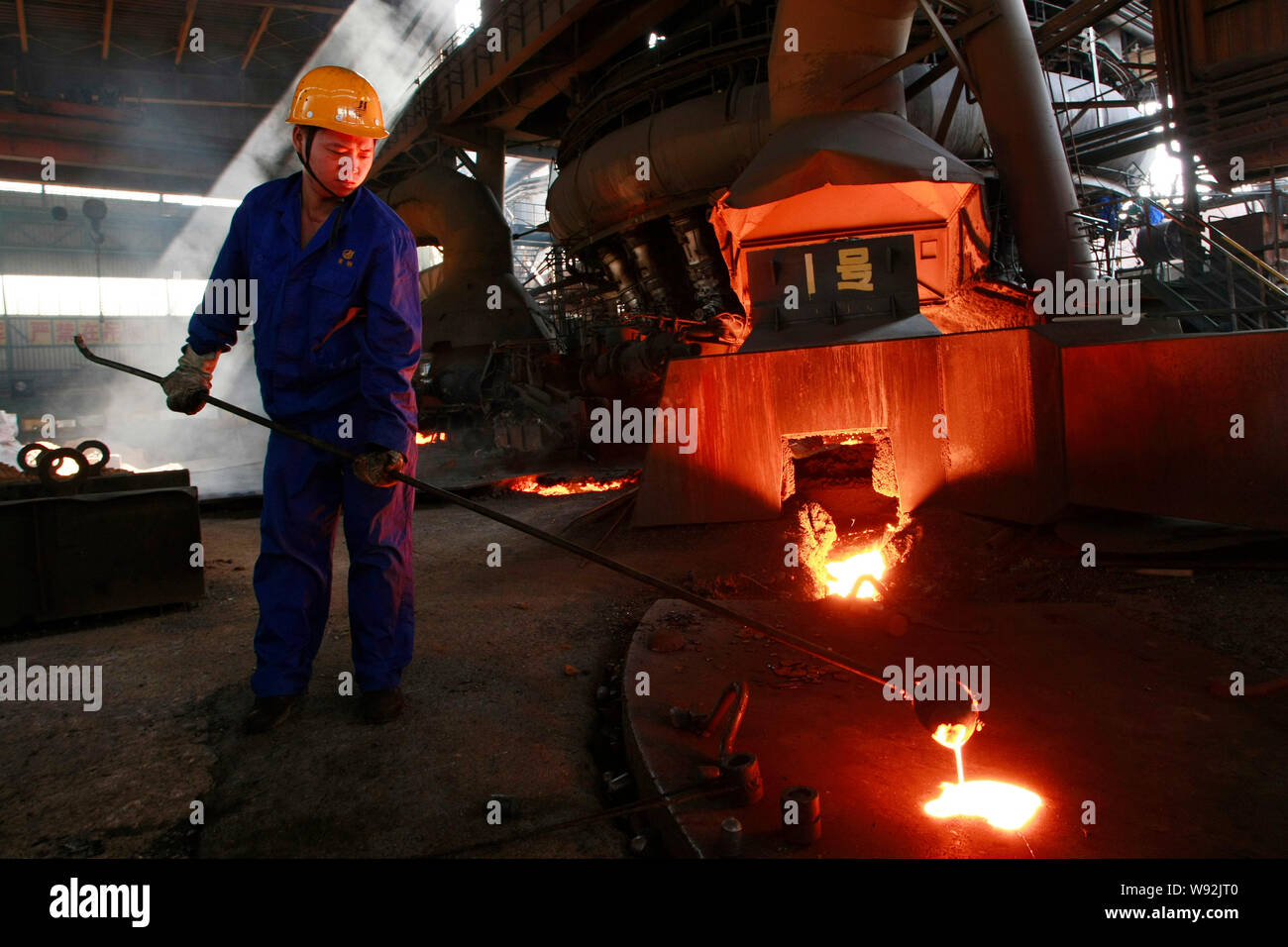 --FILE--A Chinese worker produces steel at a steel plant in Hengyang ...