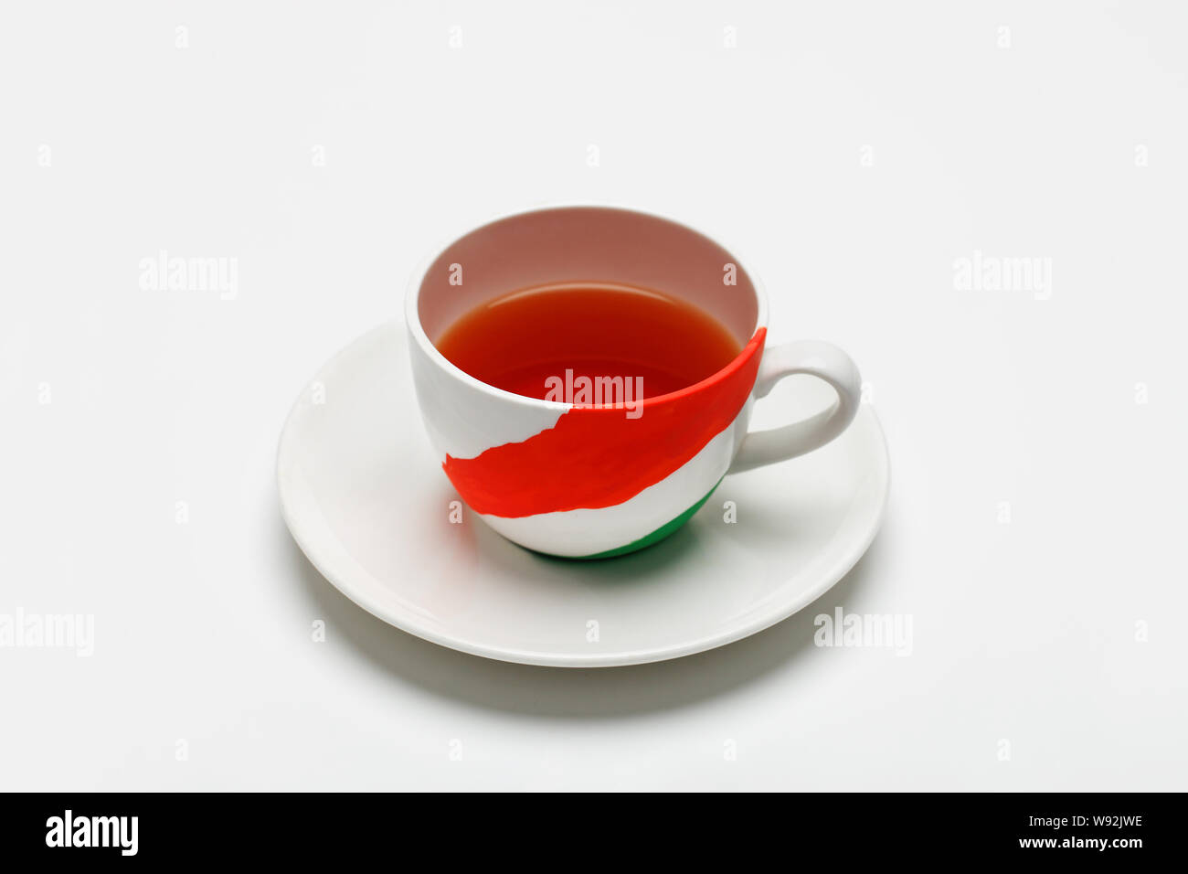 Cup of herbal tea representing Indian Flag Stock Photo - Alamy