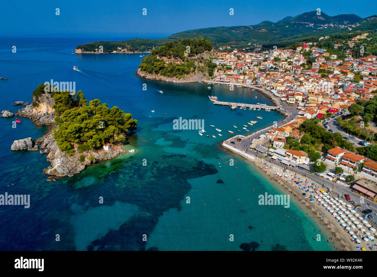Aerial cityscape view of the coastal city of Parga, Greece during the ...