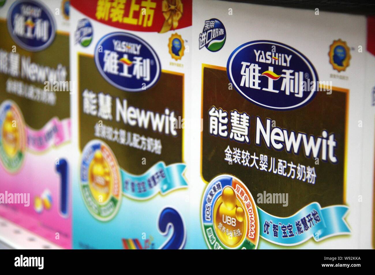 --FILE--Cartons of Yashili Newwit infant milk powder are for sale at a ...