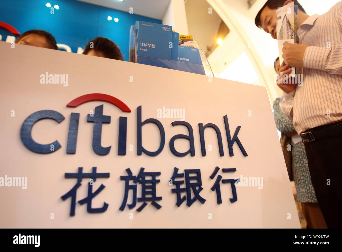 --FILE--People visit the stand of Citibank during an exhibition in ...