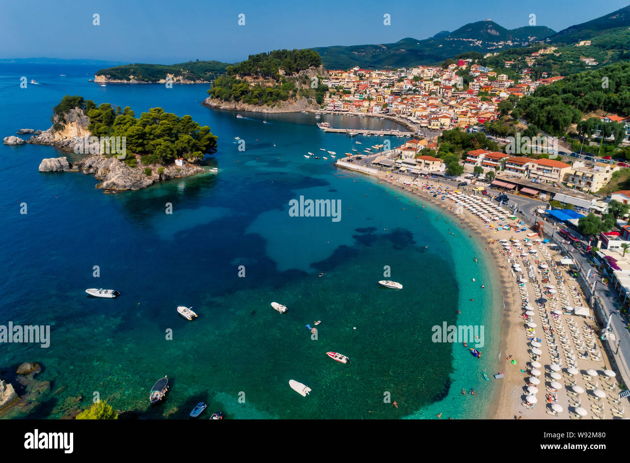 Aerial cityscape view of the coastal city of Parga, Greece during the ...