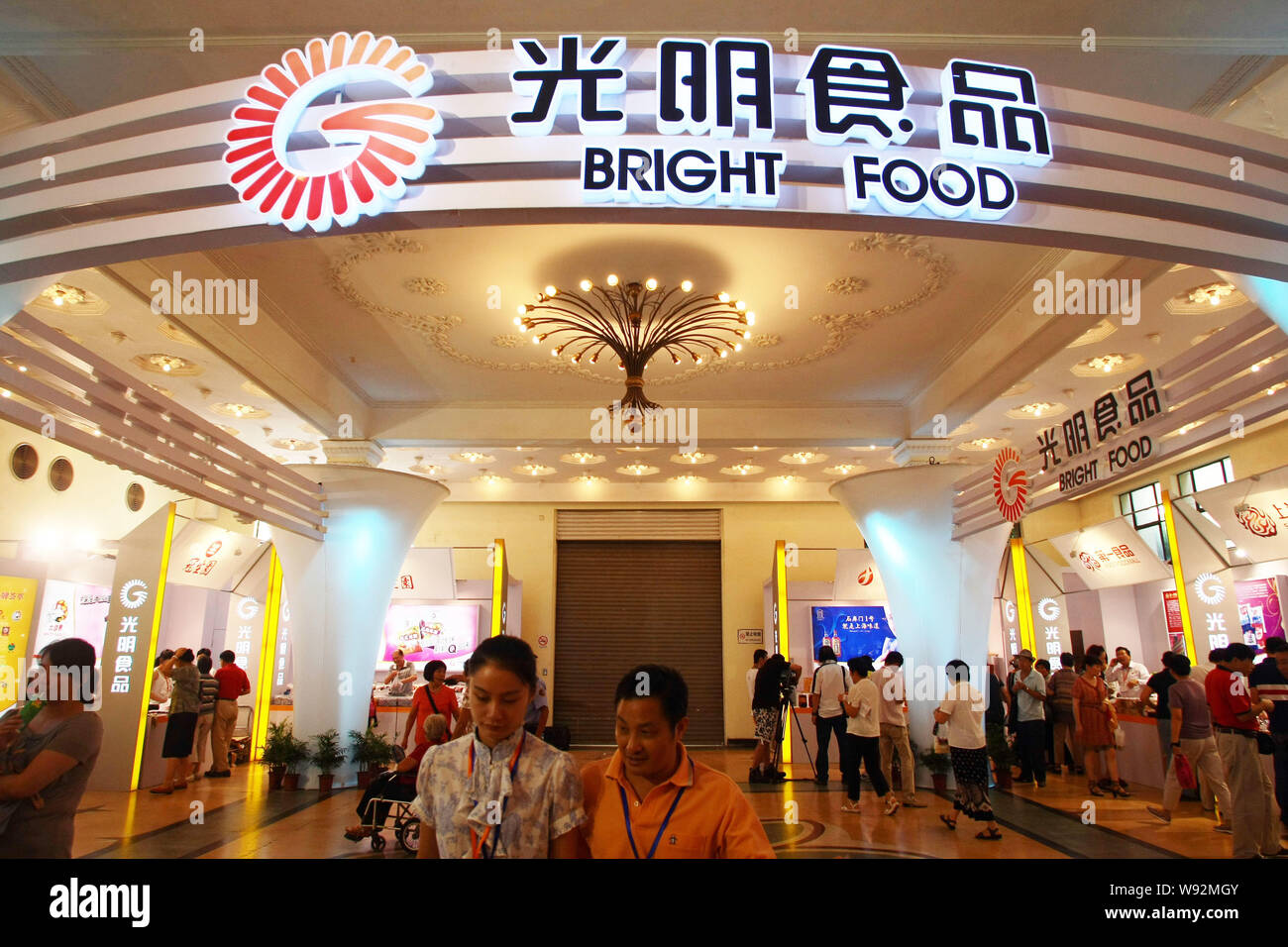 --FILE--People visit the stand of Bright Food during a fair in Shanghai ...