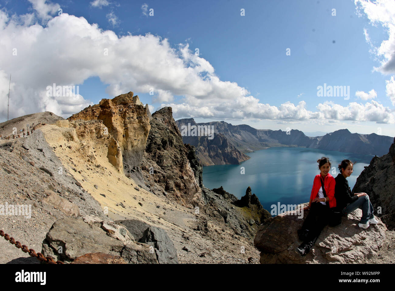 --FILE--Tourists pose by the Changbaishan Tianchi, or the Heavenly Lake ...