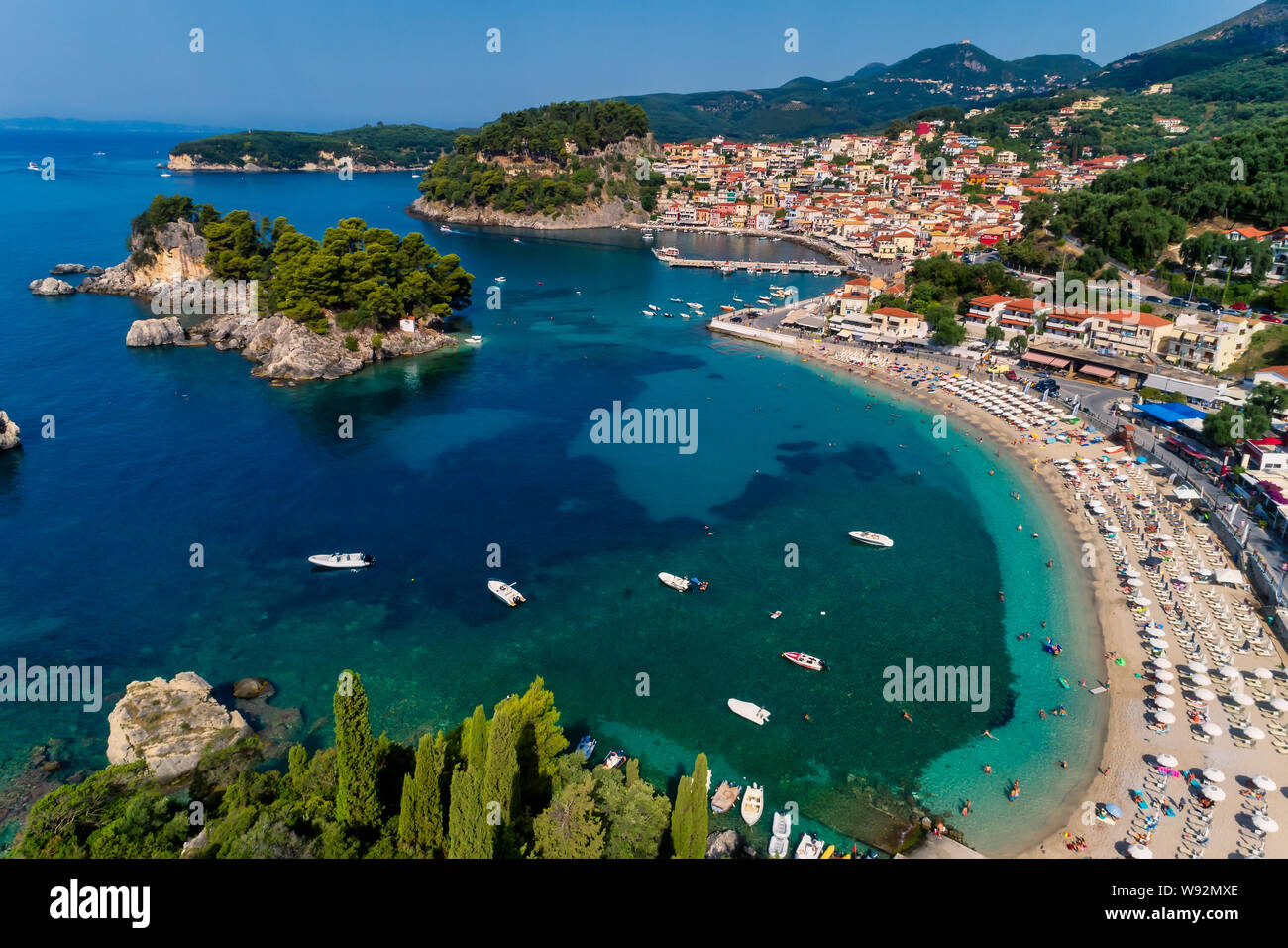 Aerial cityscape view of the coastal city of Parga, Greece during the ...
