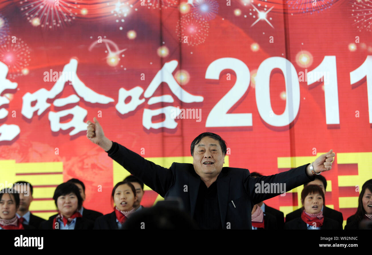 --FILE--Zong Qinghou, center, Chairman and CEO of Wahaha Group, sings ...