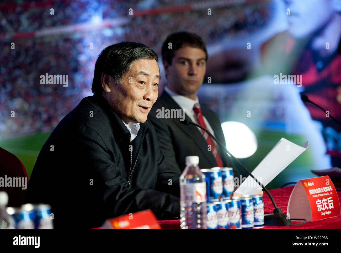 Zong Qinghou, left, founder and chairman of Wahaha Group, speaks next ...