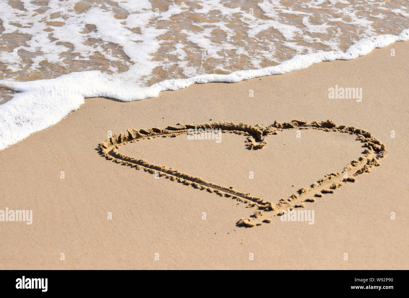 Love Heart Drawn in the Sand on a Beach Stock Photo - Alamy
