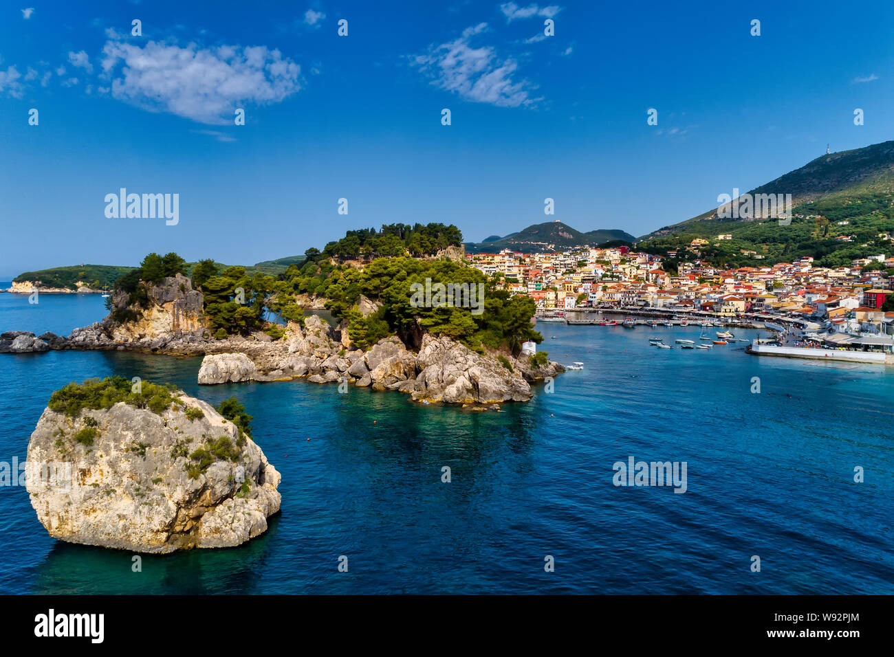Aerial cityscape view of the coastal city of Parga, Greece during the ...