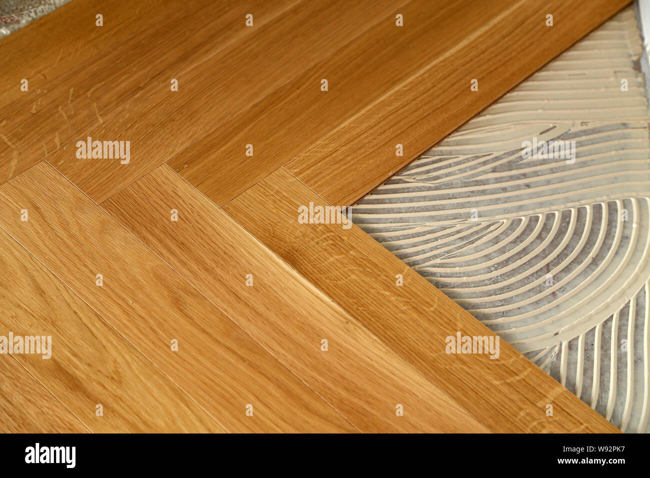 Construction in a renovated room installation of parquet Stock Photo ...