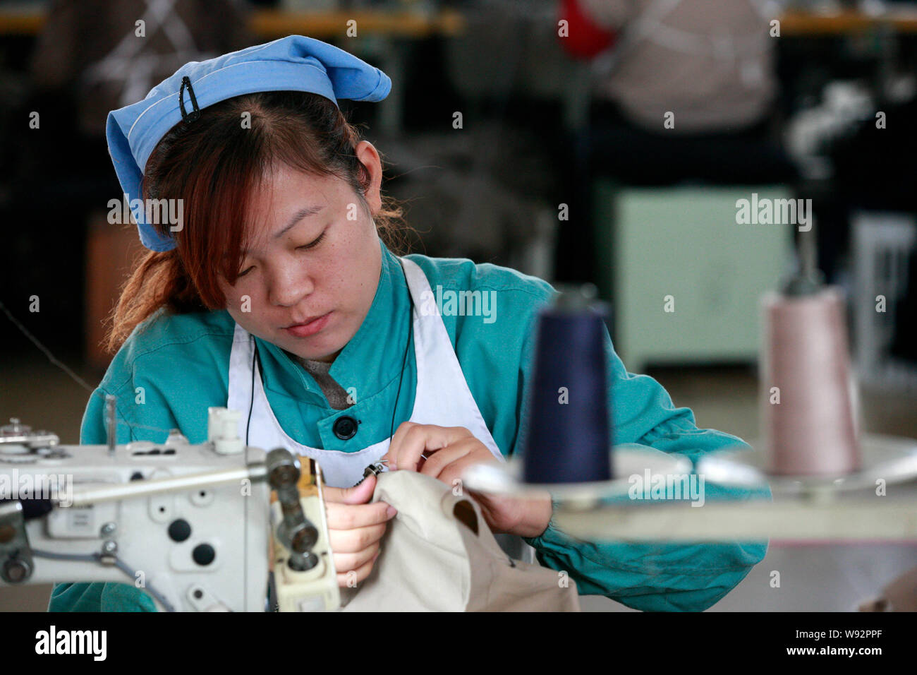 Garment factory worker southeast asia hi-res stock photography and images - Alamy