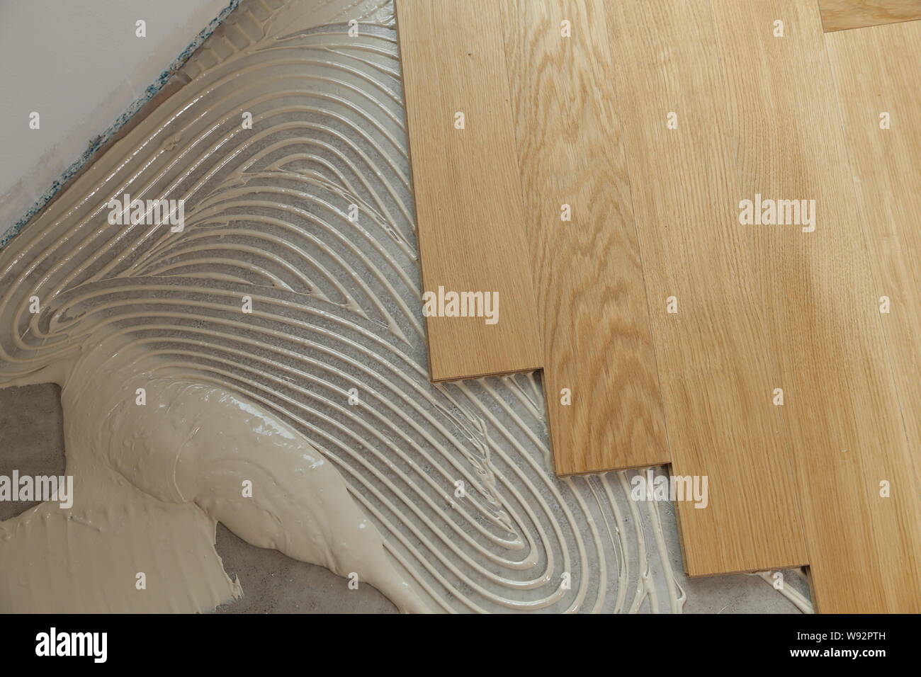 Construction in a renovated room installation of parquet Stock Photo ...