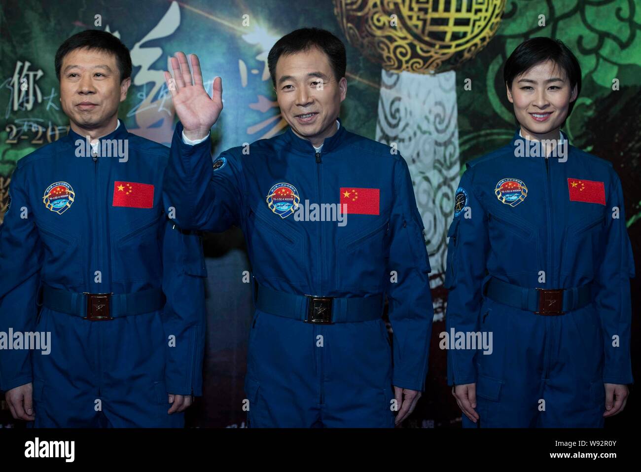 Chinese astronauts Jing Haipeng (left), Liu Wang (center) and Liu Yang (right), smiles during ...