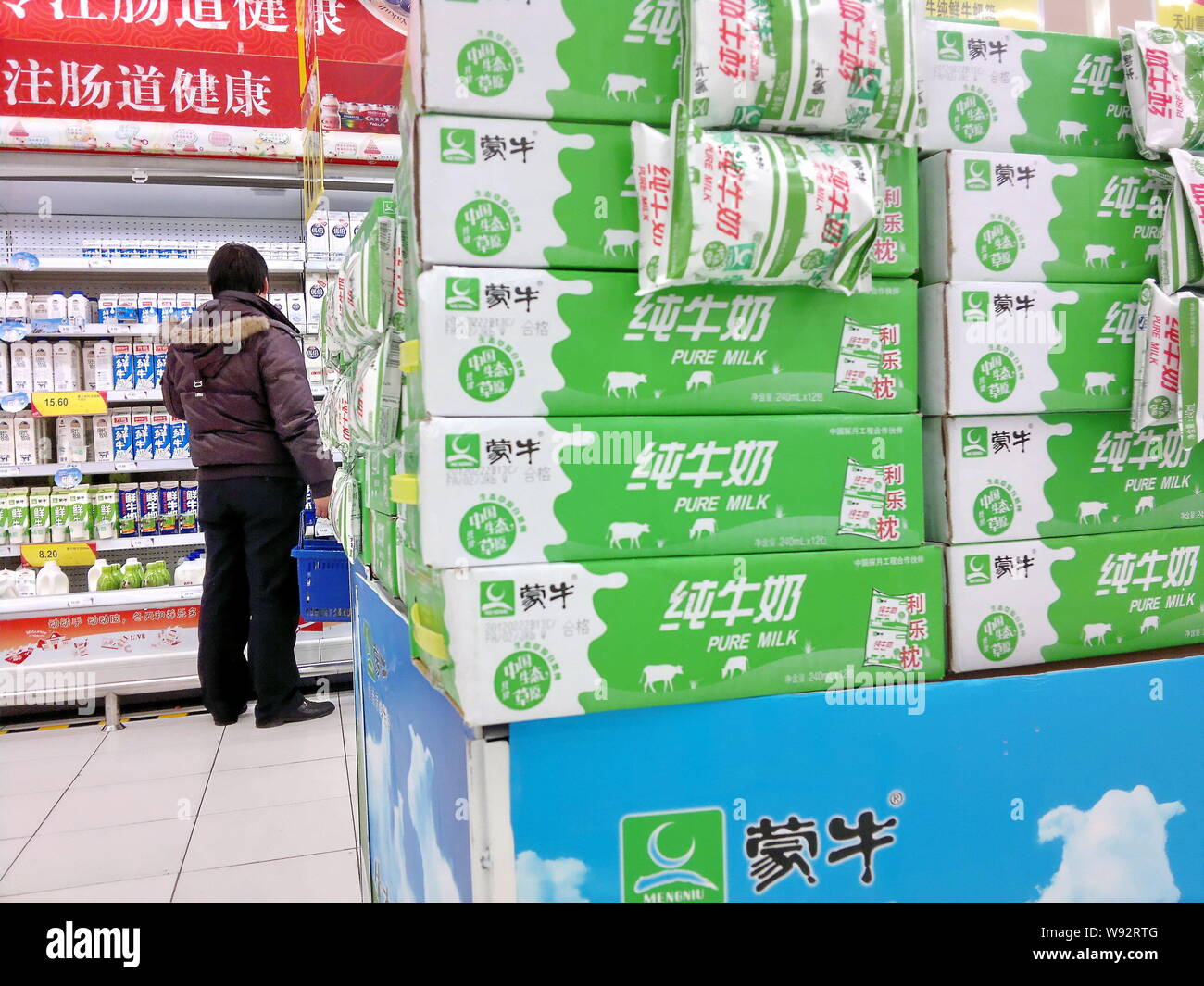 --FILE--Cartons of Mengniu pure milk are displayed for sale in a ...