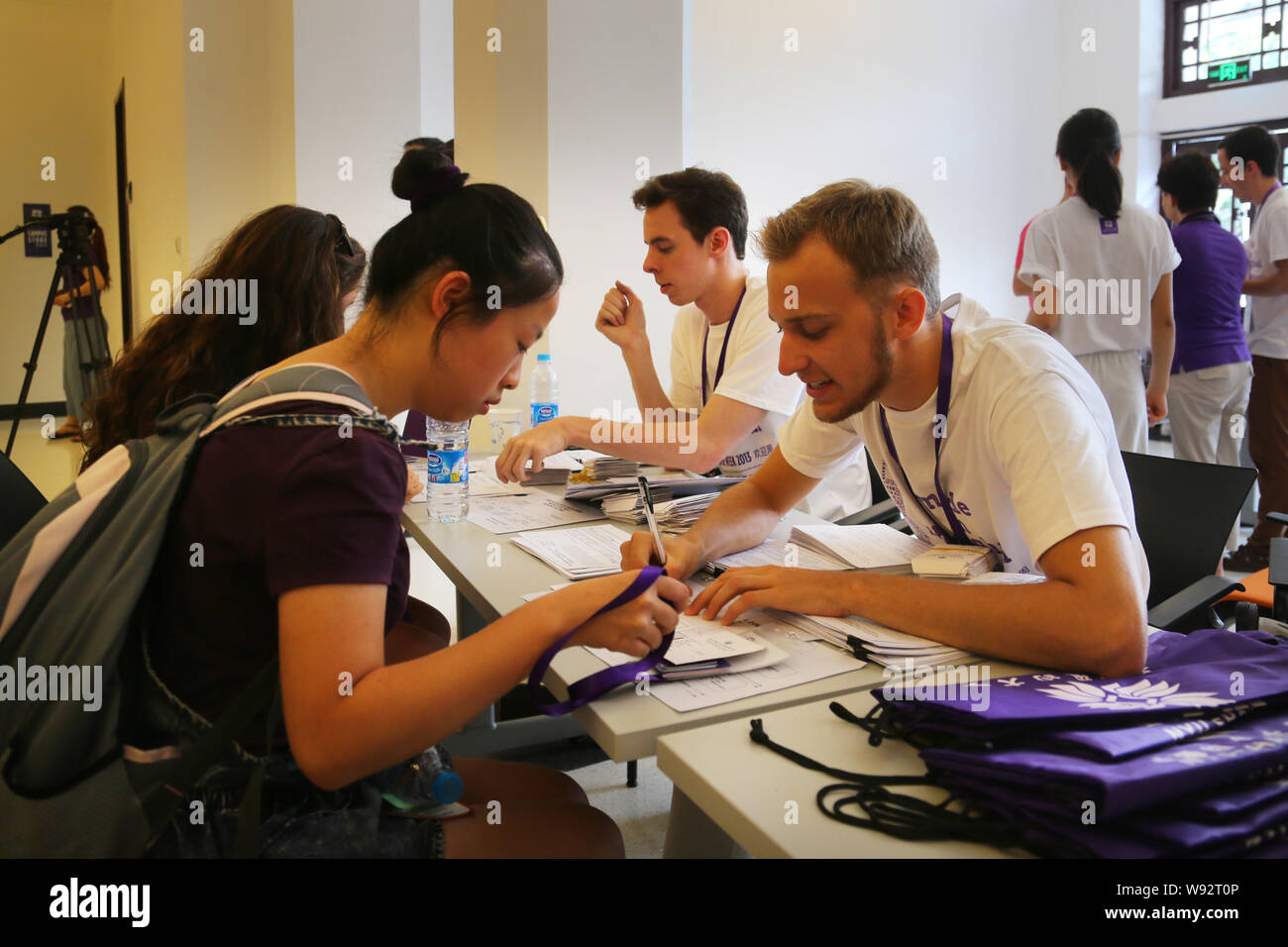 New York University Shanghai freshmen register at the reception desk as ...
