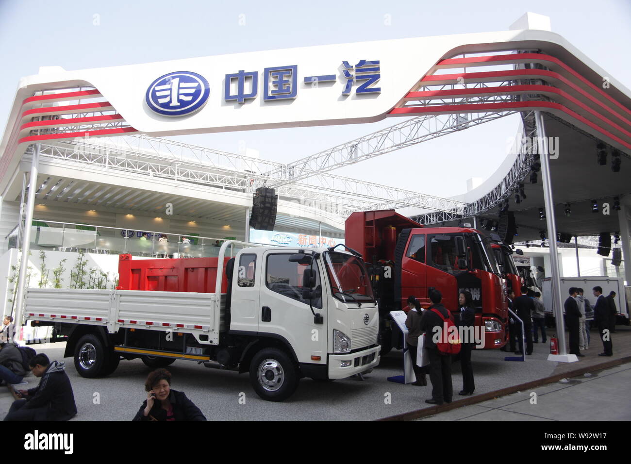 --FILE--People visit the stand of FAW (First Automobile Works)during ...