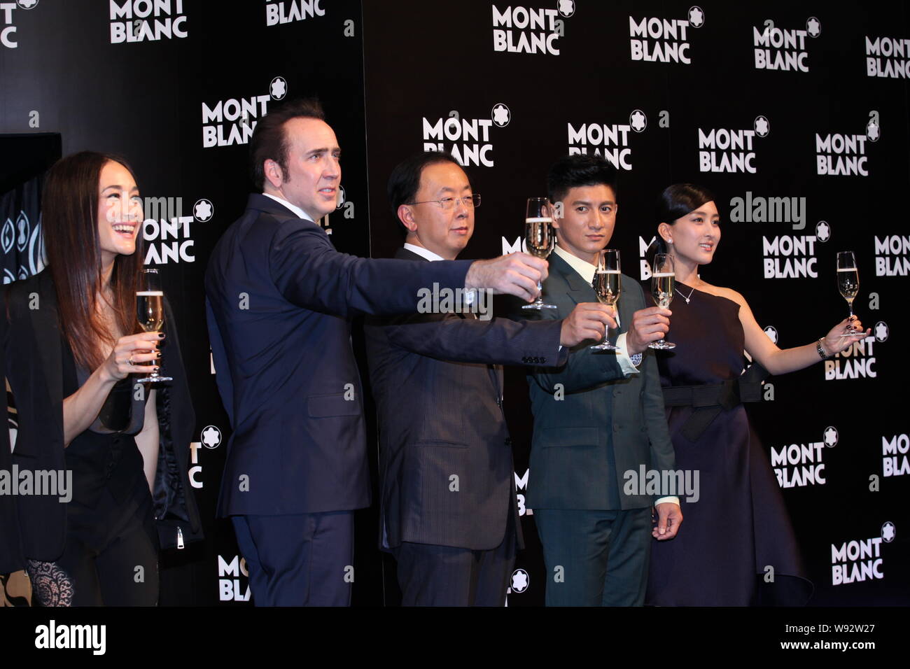U.S. actor Nicolas Cage, second left, Hong Kong actress Maggie Q, left ...