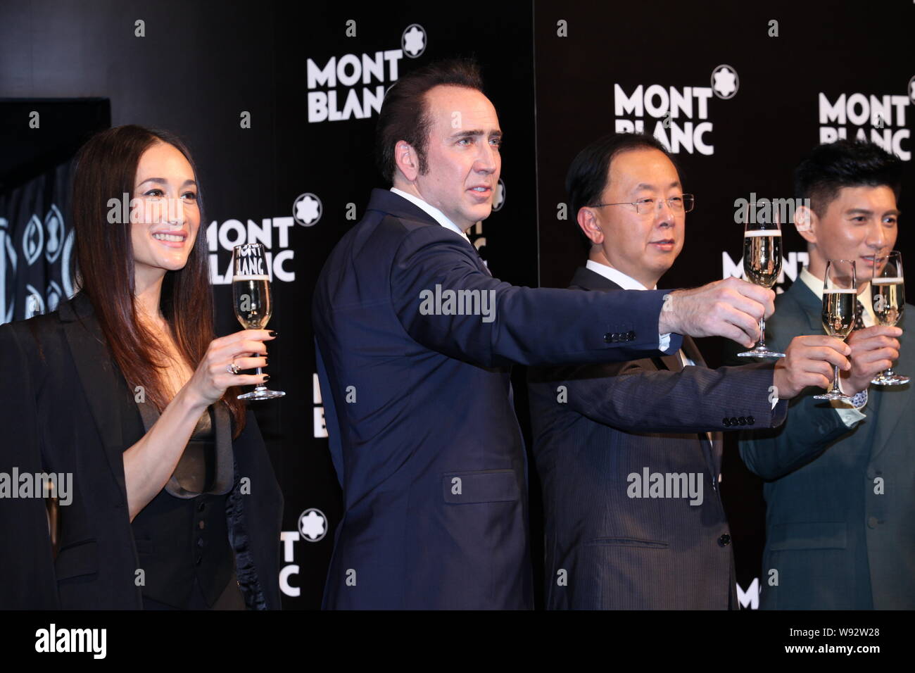 U.S. actor Nicolas Cage, second left, Hong Kong actress Maggie Q, left ...