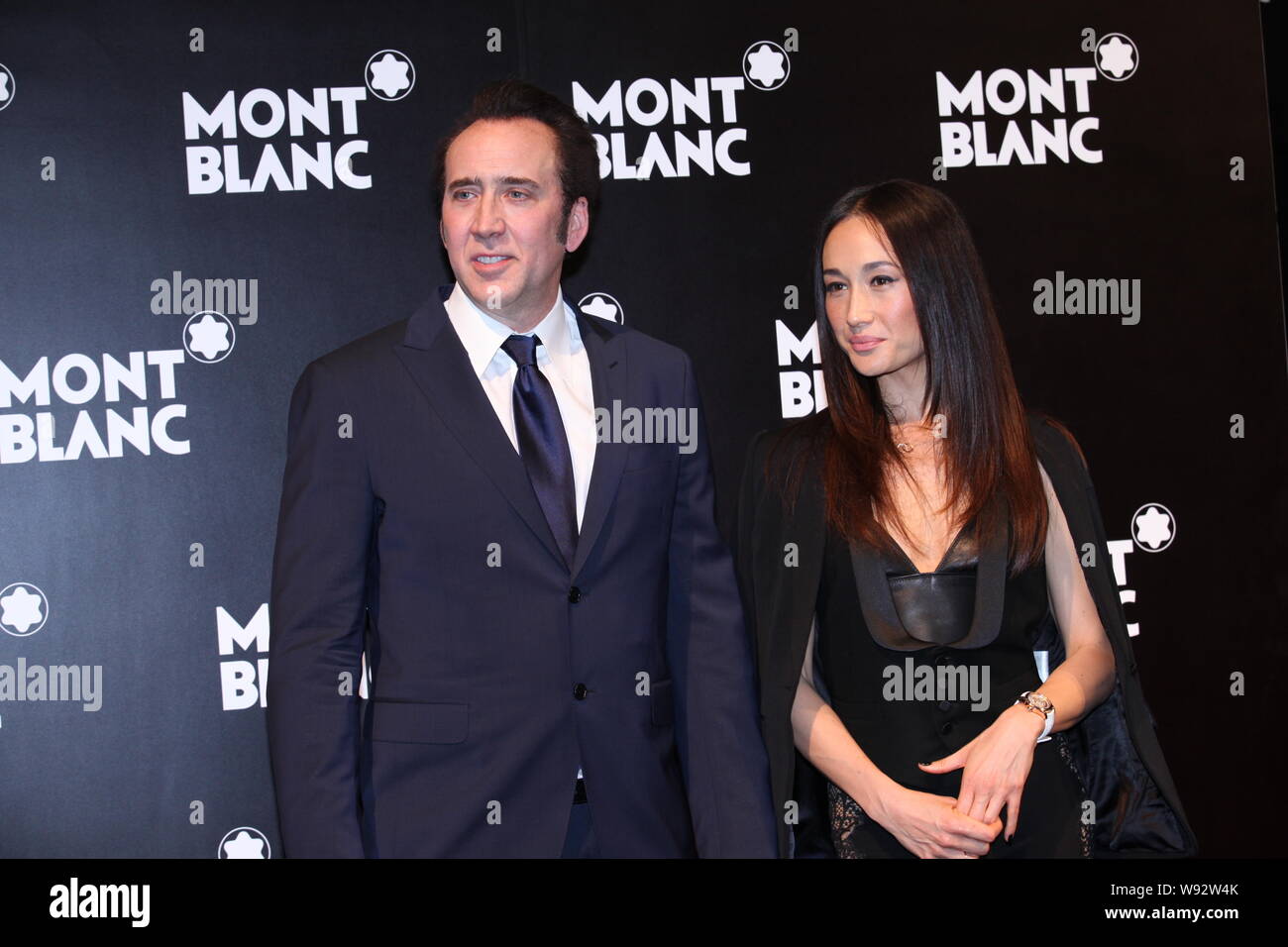U.S. actor Nicolas Cage, left, and Hong Kong actress Maggie Q pose at ...