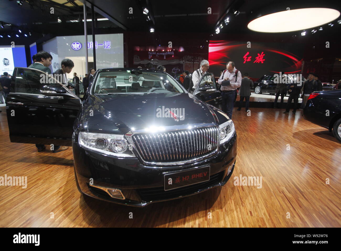 --FILE--Visitors look at a Red Flag (Hongqi) H7 PHEV of FAW during the ...
