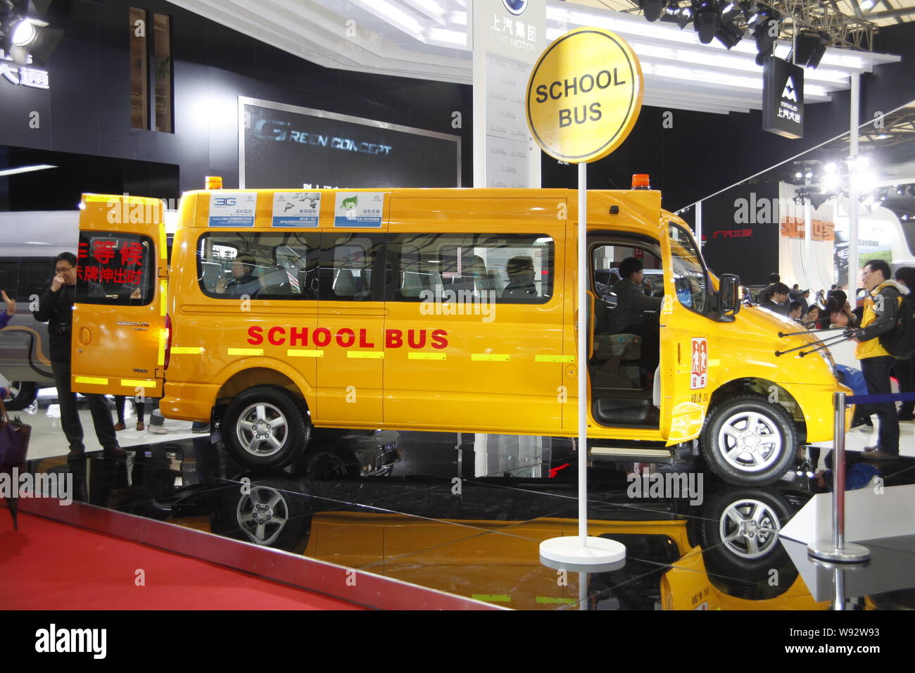 --FILE--Visitors look at a school bus displayed during the 15th ...