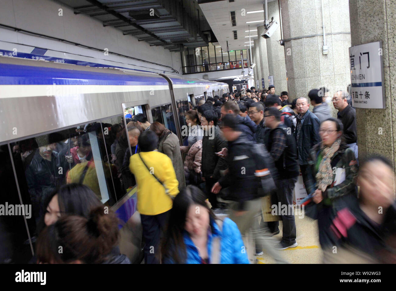 --FILE--Passengers walk into a crowded Metro train at a subway station ...