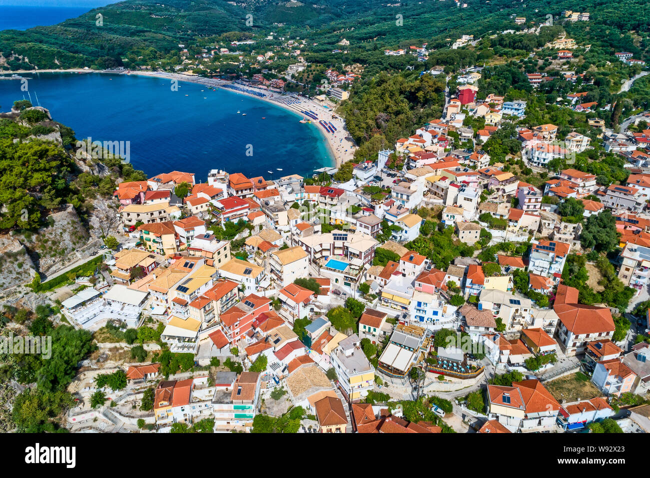 Aerial cityscape view of the coastal city of Parga, Greece during the ...