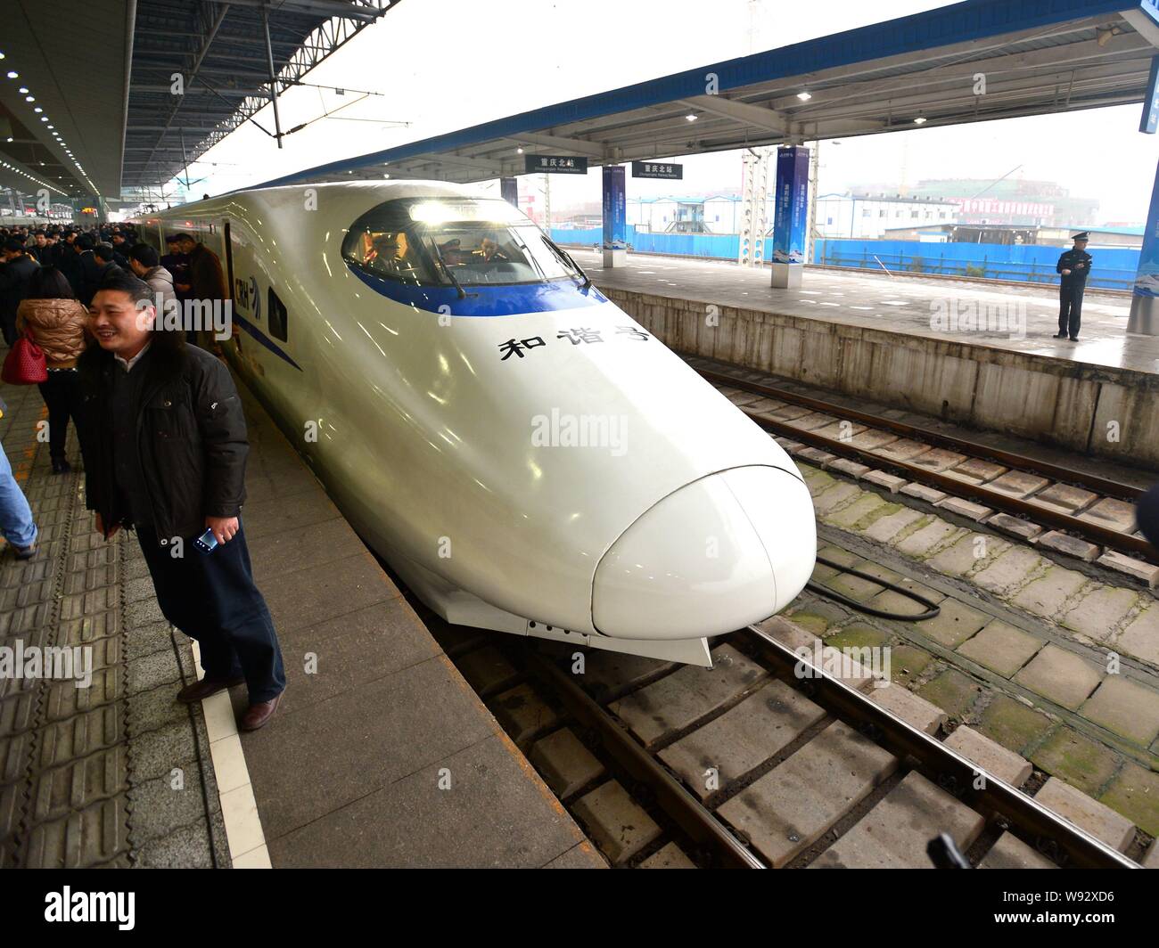 Passengers rush to board a CRH (China Railway High-speed) train before ...