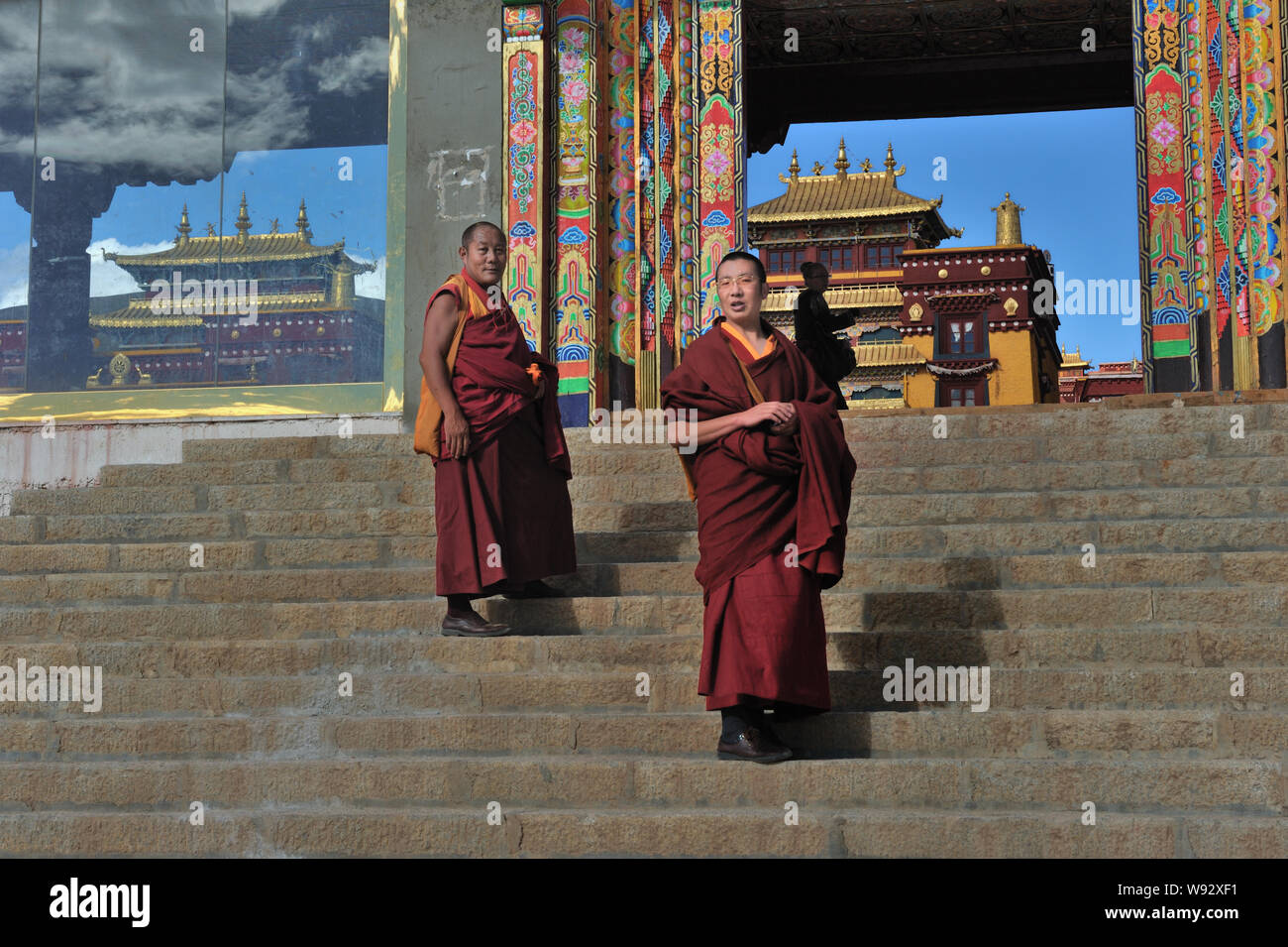 --FILE--Two lamas stand in front of the Ganden Thubchen Choekhorling ...