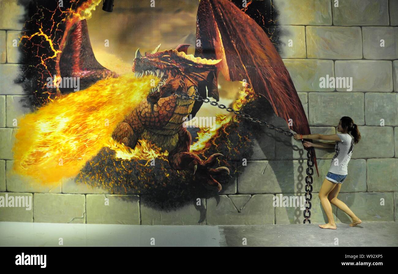A Chinese young woman poses to pull a fire-breezing dragon for a 3D ...
