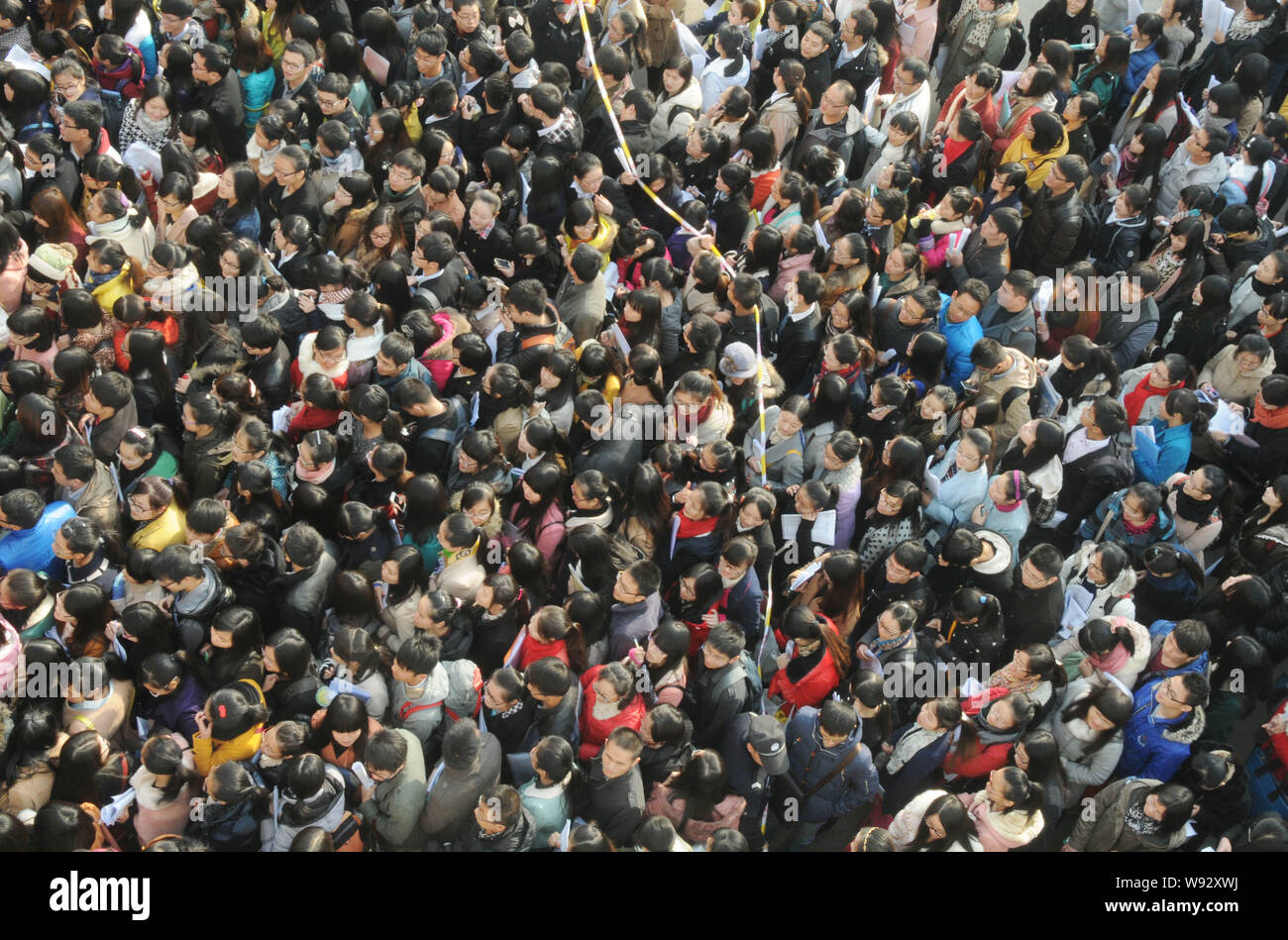 A crowd of Chinese students queue up for a job fair at Zhejiang Normal ...