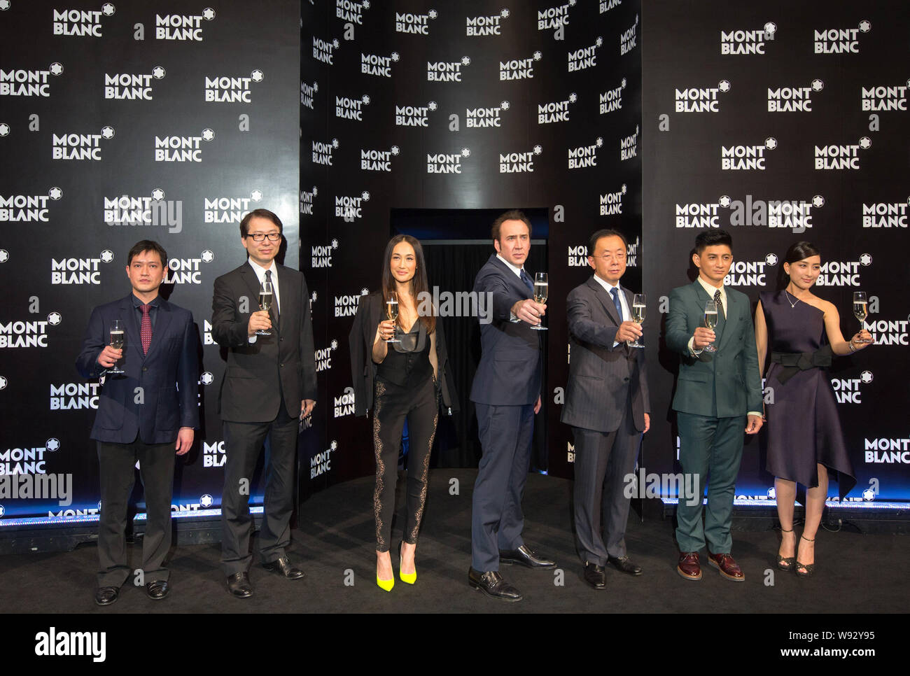 U.S. actor Nicolas Cage, center, Hong Kong actress Maggie Q, third left ...
