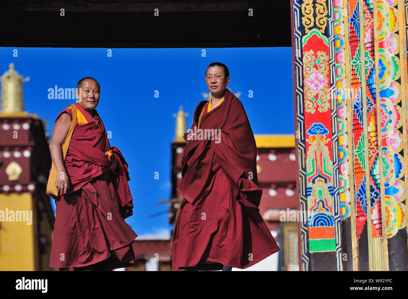 --FILE--Two lamas stand in front of the Ganden Thubchen Choekhorling ...