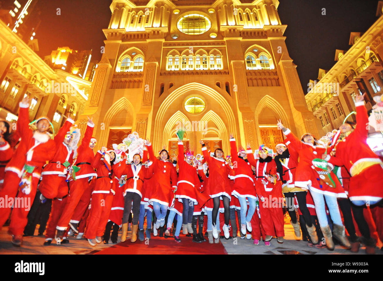 Young Chinese students dressed Santa Claus costumes celebrate Christmas ...