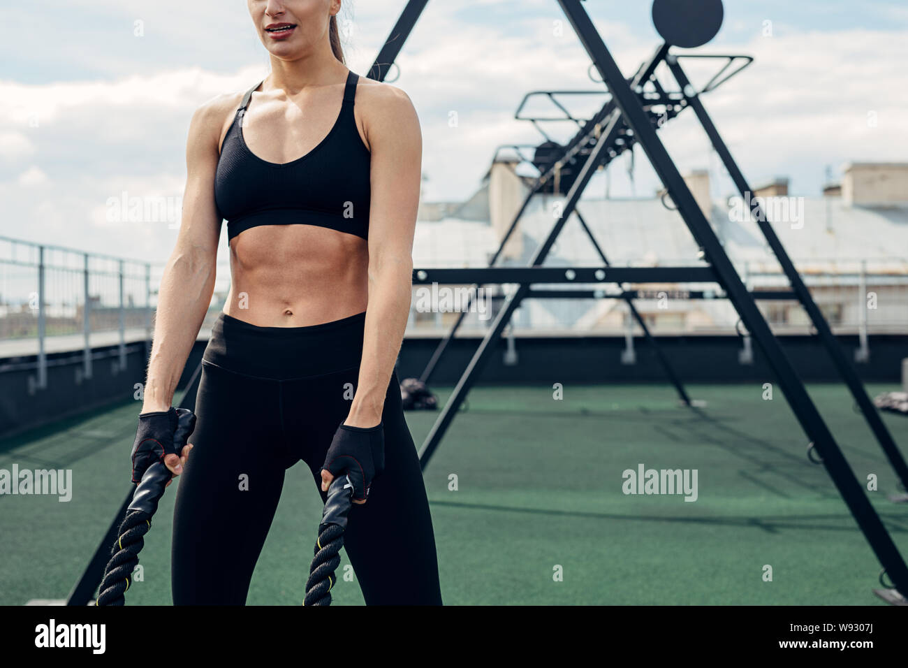 Unrecognizable athlete taking a break after intense workout Stock Photo ...