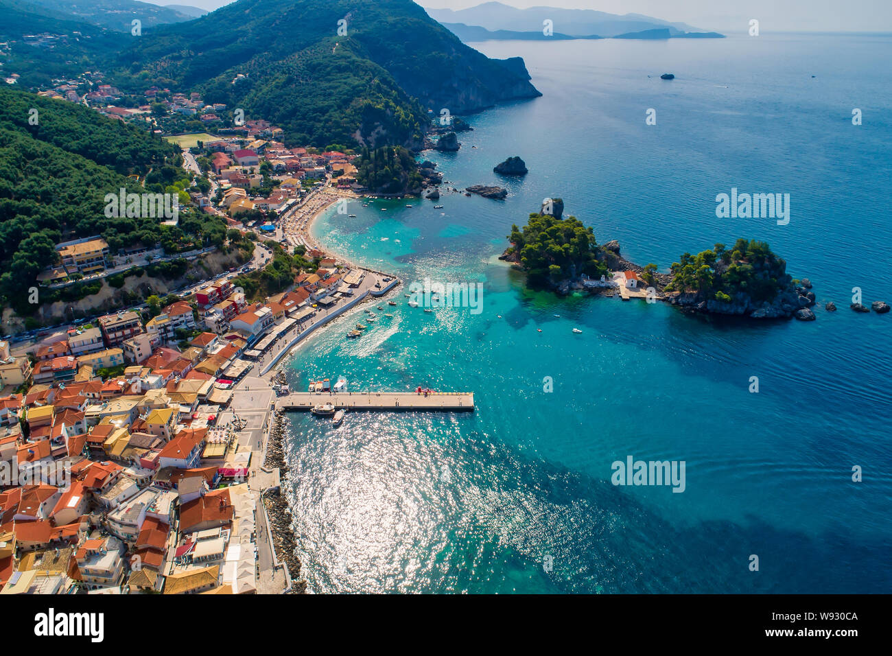 Aerial cityscape view of the coastal city of Parga, Greece during the ...