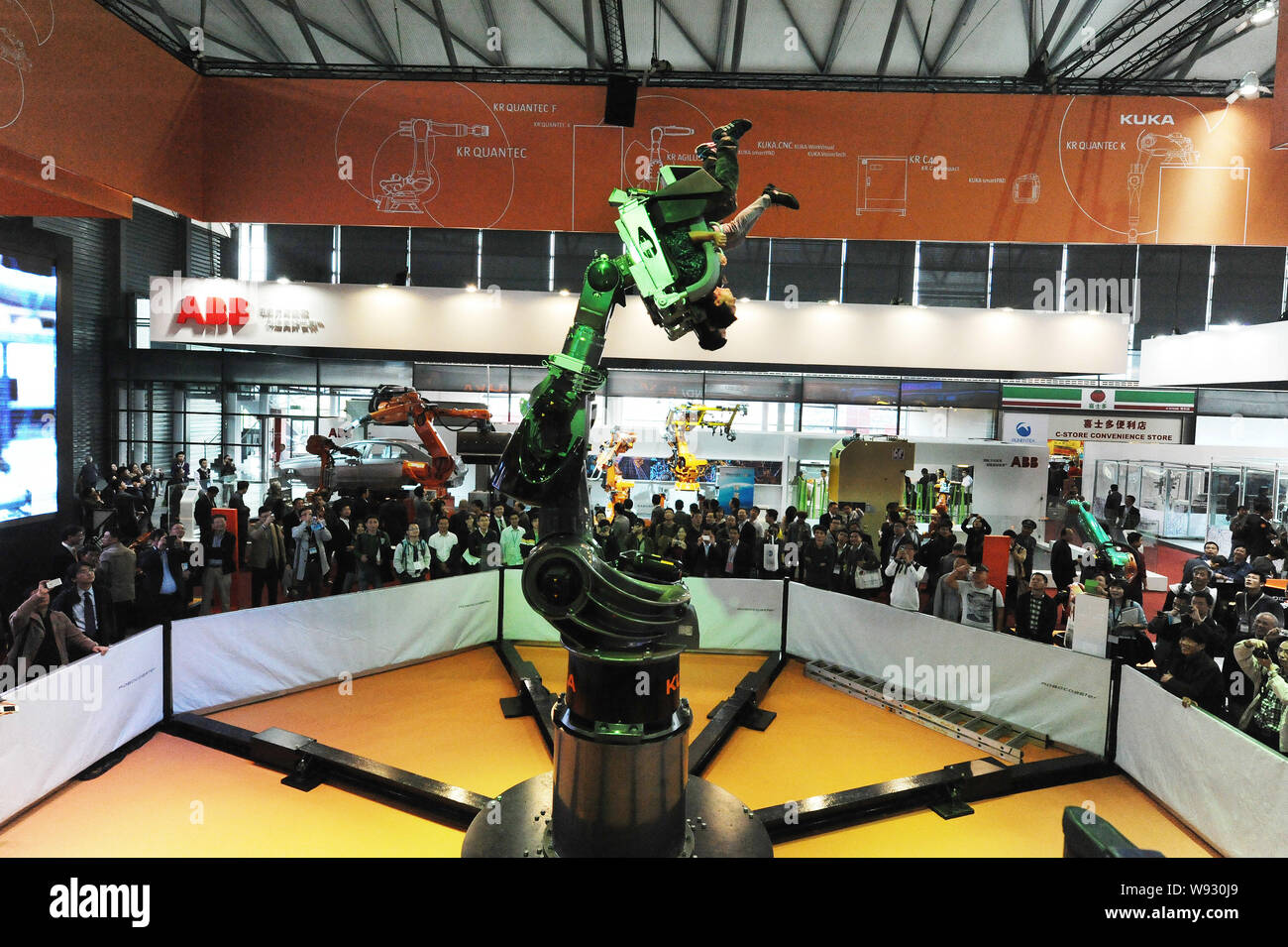 Visitors experience a Robocoaster manufactured by KUKA Robot Group ...
