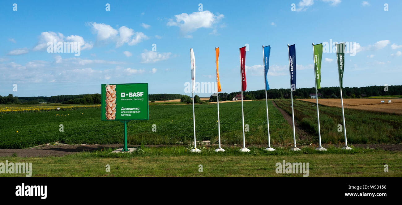 Billboard with Basf trademark and flags on pilot field Stock Photo - Alamy