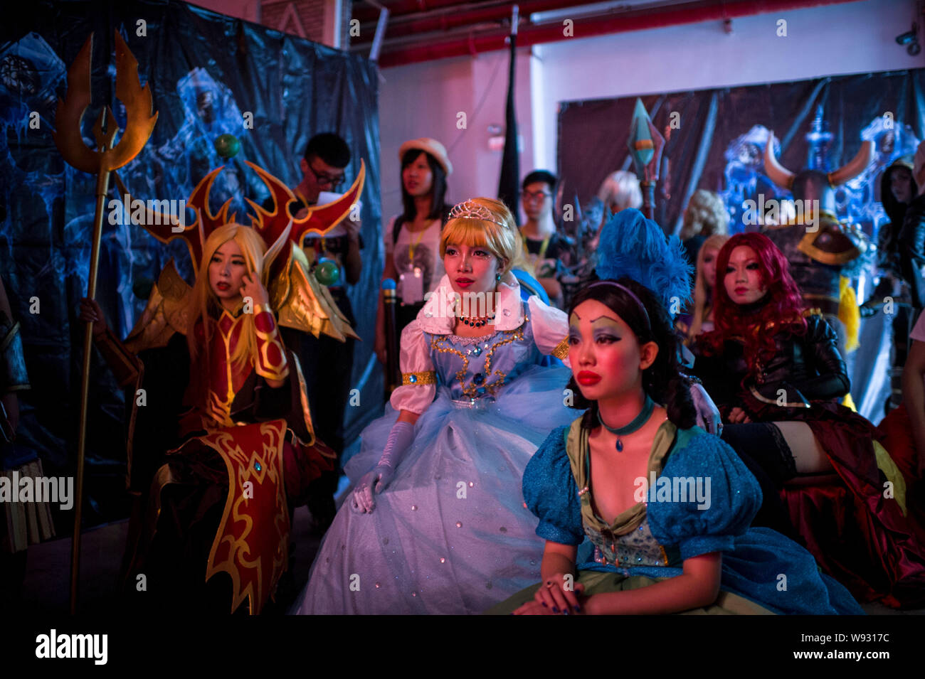 Chinese contestants dressed in cosplay costumes wait for their ...