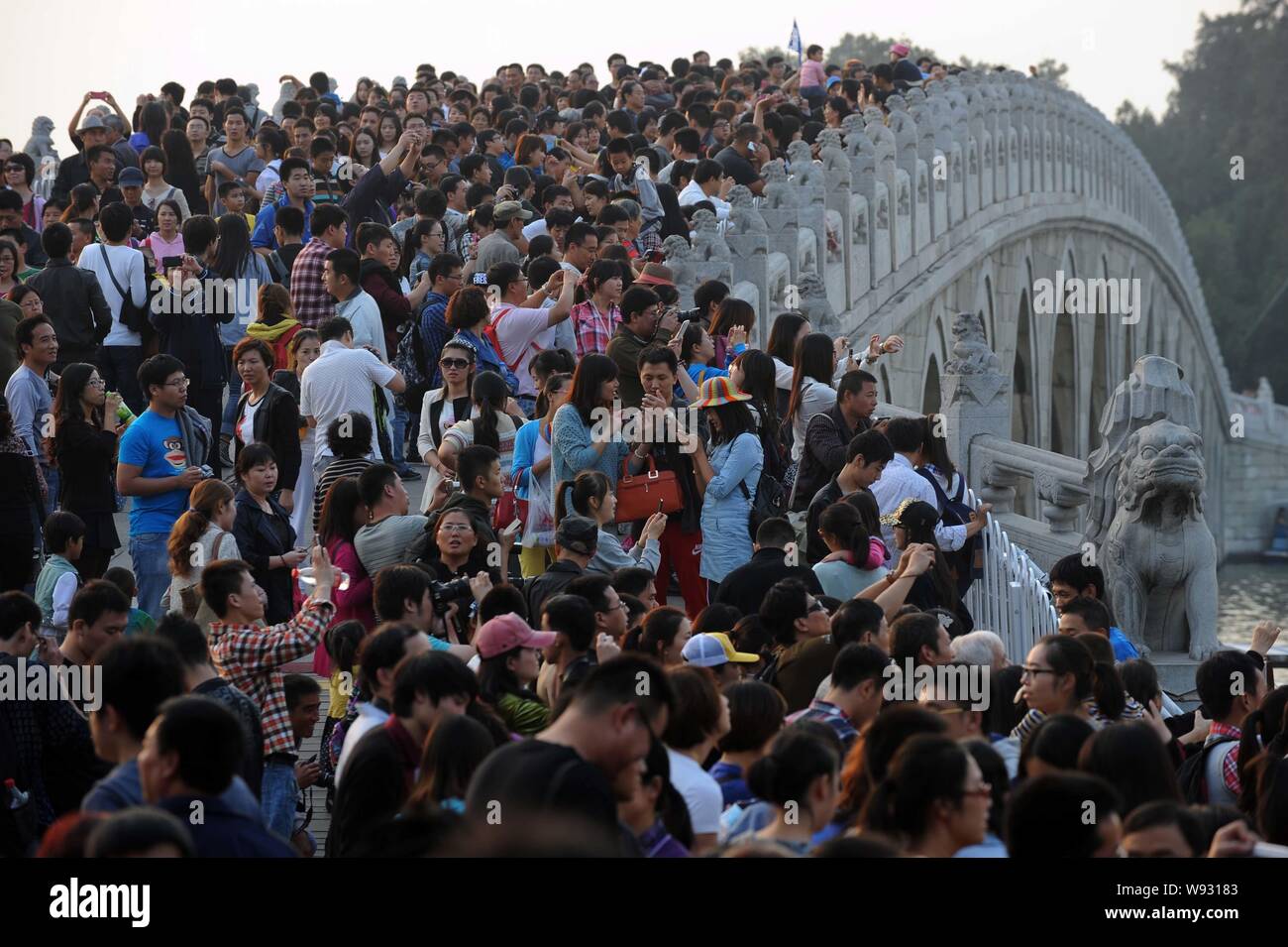Tourists crowd on the 17 Arch Bridge at the Summer Palace during the ...