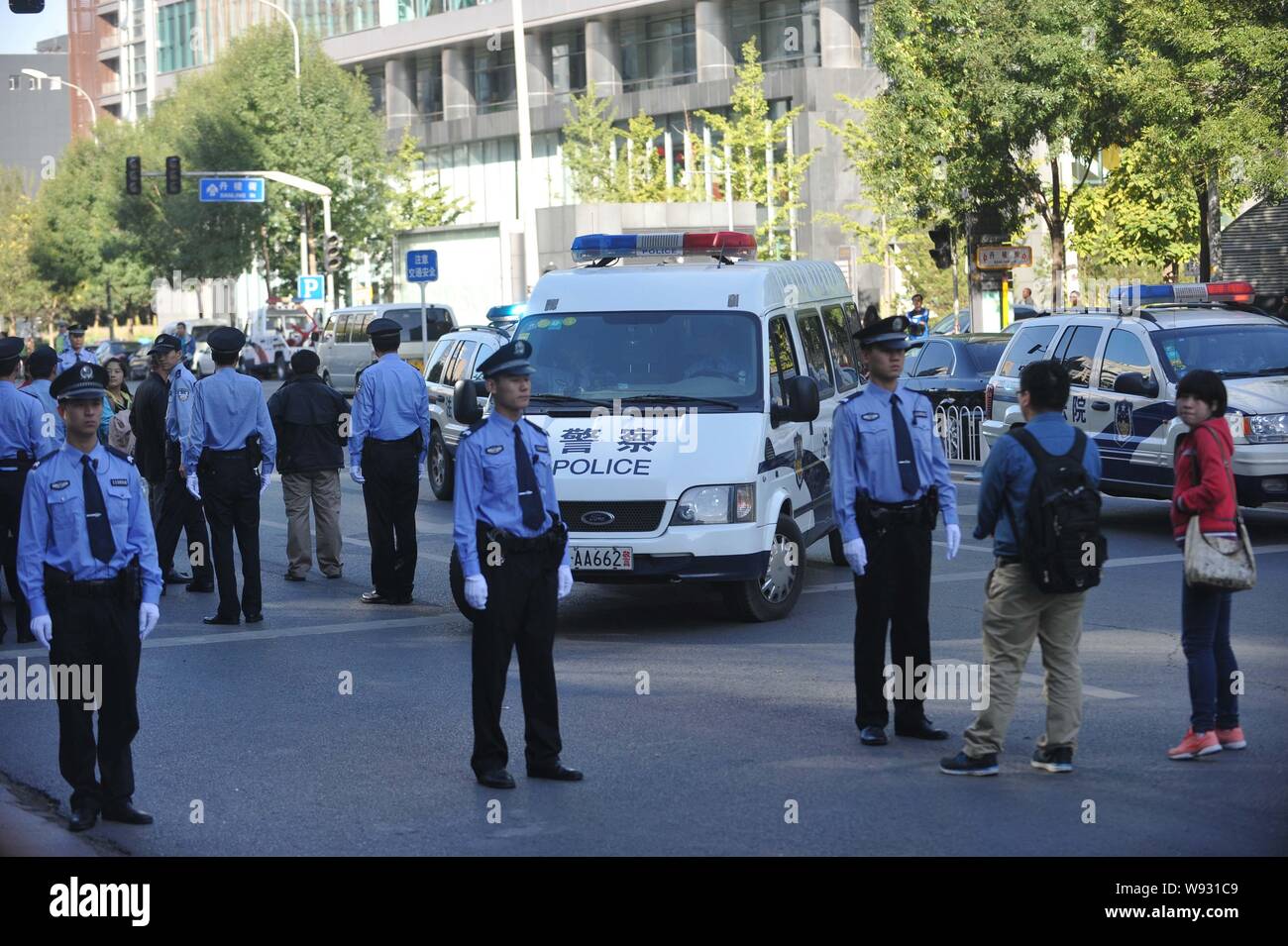 A police car carrying Li Tianyi, the son of Chinese PLA singers Li ...